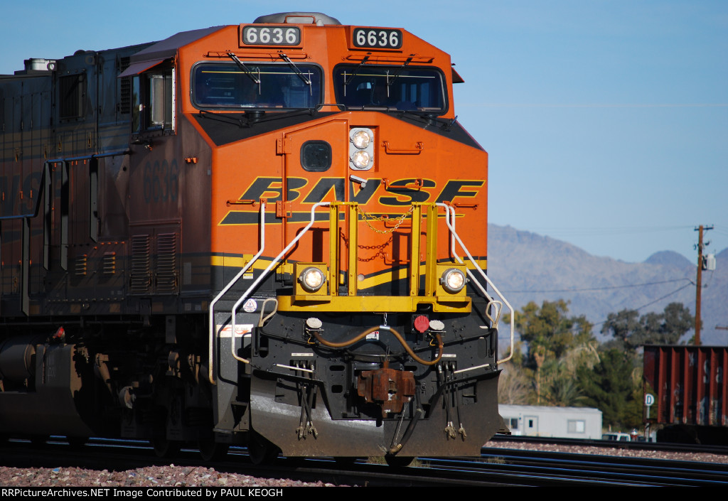 BNSF 6636 heads into a Blinding sunrise as she rolls eastbound with a Z-Train. (I will catch up ...